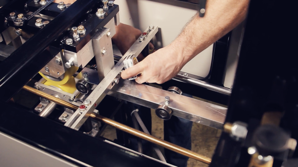 Entry Guide Adjustment on an NTM MACH II™ Gutter Machine